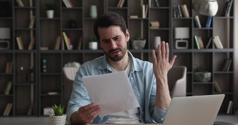 Frustrated Young Man Looking Through Paper Stock Footage Video (100% ...