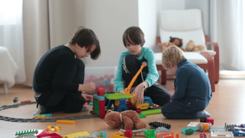 cute children brothers playing colorful toy Stock Footage Video (100% ...