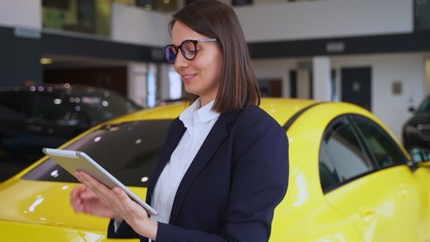 Female Salesperson Using Tablet Standing Near Stock Footage Video (100% ...