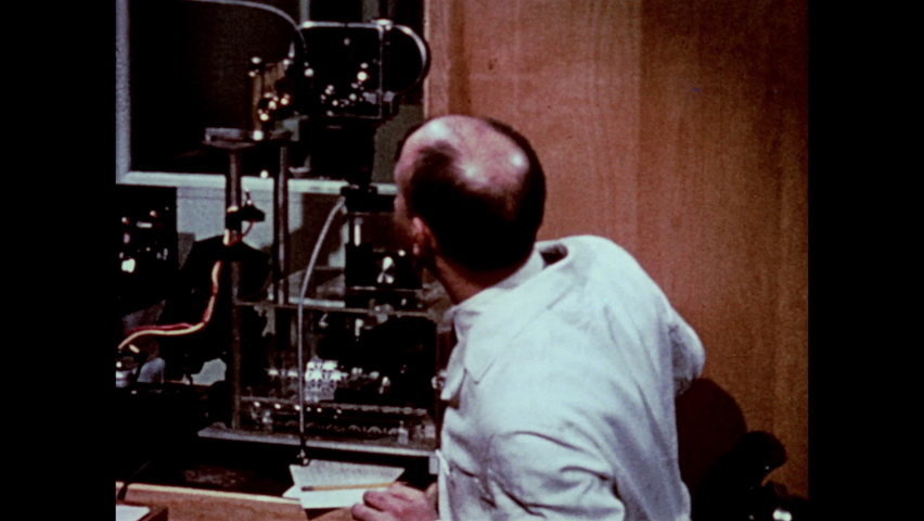 1950s: Scientist at Microscope. Radiation Stock Footage Video (100% ...