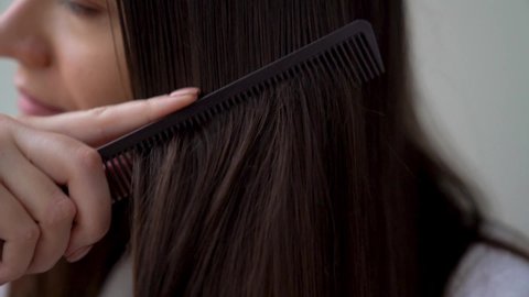 Young Brunette Woman Combing Out Hair Stock Footage Video (100% Royalty ...