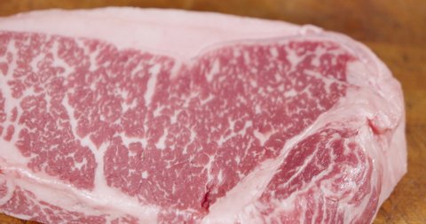 Close Raw Marbled Beef Steak Moving Stock Footage Video (100% Royalty ...