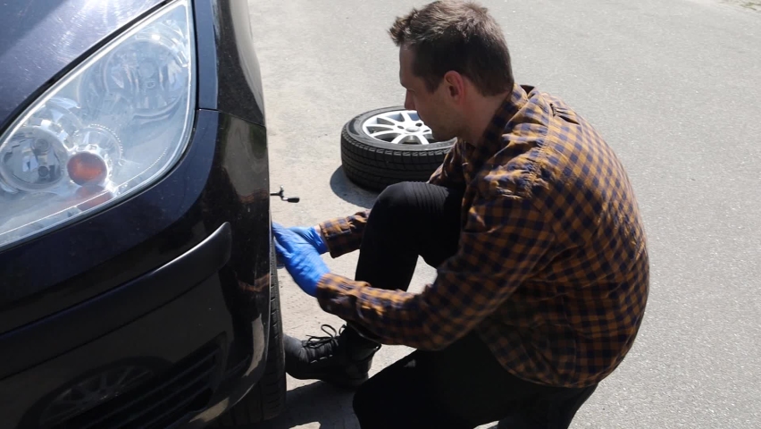 car mechanic using jack change car's Stock Footage Video (100% Royalty ...