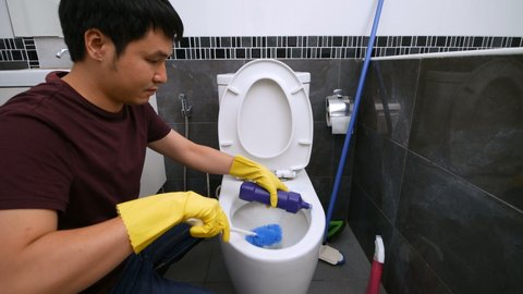 Young Man Cleaning Toilet Bowl Bathroom Stock Footage Video (100% ...