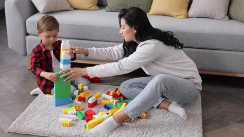 Mum Helping Child Building Tower Wooden Stock Footage Video (100% ...