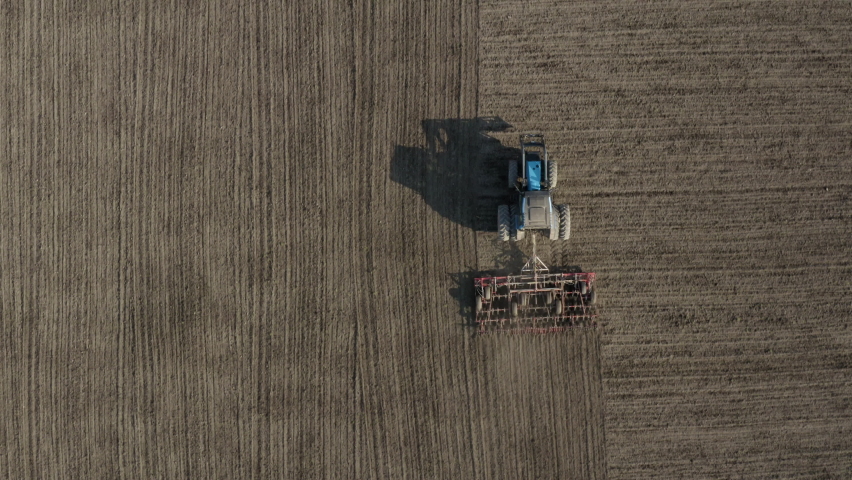 aerial top down view tractor harrowing Stock Footage Video (100% ...