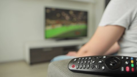 Fan Buff Sits On Couch Home Stock Footage Video (100% Royalty-free ...