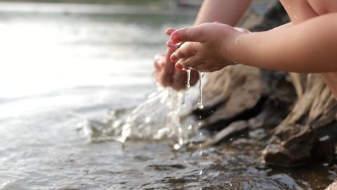 Close Hand Adult Child Touching Water Stock Footage Video (100% Royalty ...