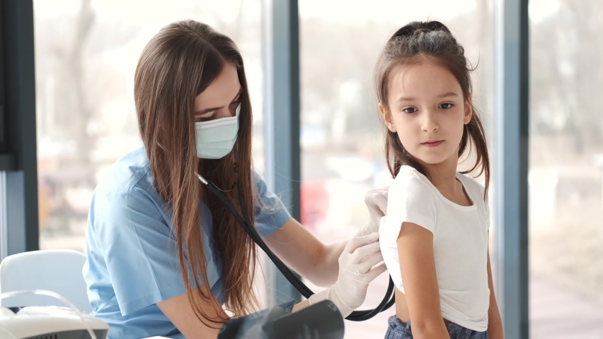 Female Doctor Examining Girls Breathing Stock Footage Video (100% ...