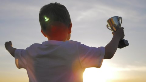 Child holding trophy Stock Video Footage - 4K and HD Video Clips ...