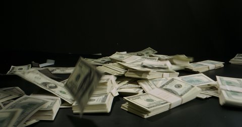 Money Rain Falling Onto Table Packs Stock Footage Video (100% Royalty ...