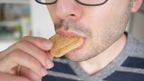Closeup Young Man Snacking On Cookie Stock Footage Video (100% Royalty ...