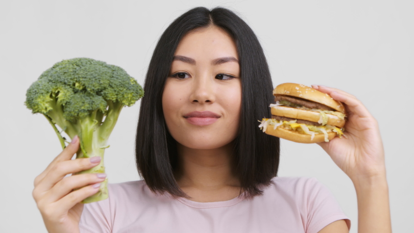 Choosing Junk Food Over Healthy Stock Video Footage - 4K and HD Video ...