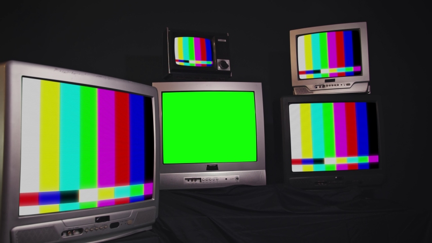 Four Old Television Sets turning on Green Screen in a Dark Room. Zoom ...