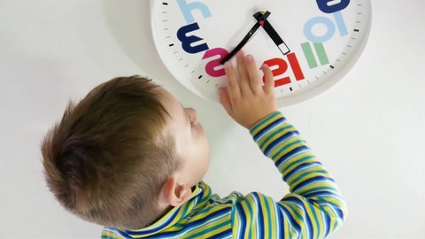 Little Boy Moves Hands Upsidedown Clock Stock Footage Video (100% ...