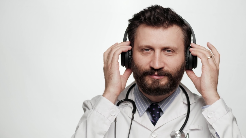 Doctor Headphones. Positive Man Doctor Stock Footage Video (100% ...
