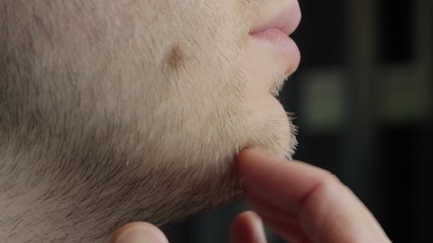 341 Scratch his beard Stock Video Footage - 4K and HD Video Clips ...