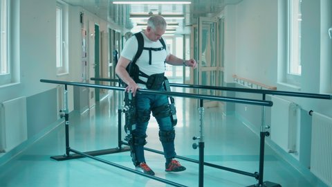 Disabled Man Walking Exosuit By Himself Stock Footage Video (100% ...