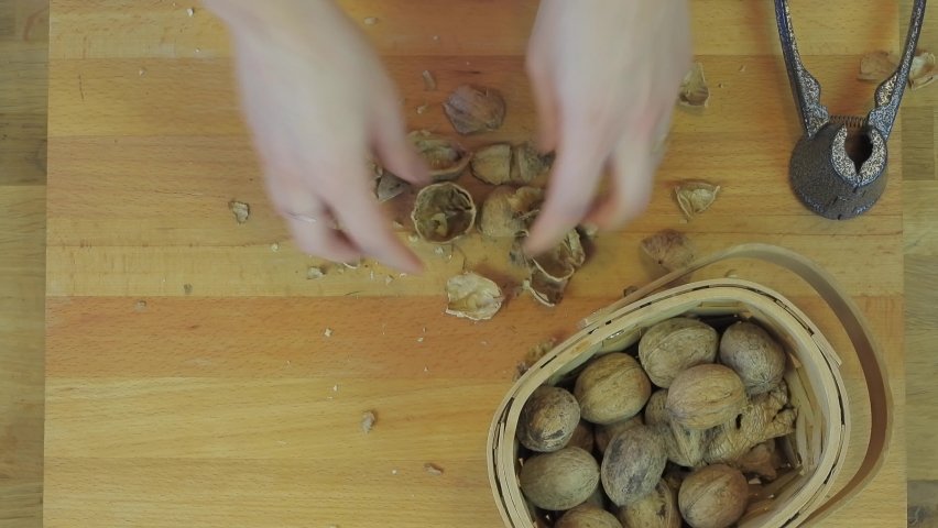 Womans Hands Cracking Walnuts with Stock Footage Video (100% Royalty ...