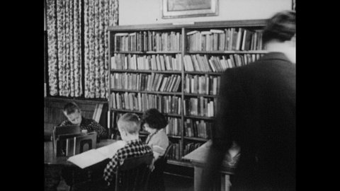 1950s Librarian Closes Book Replaces Boy Stock Footage Video (100% ...