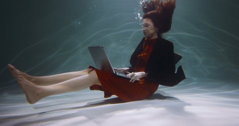 Business woman underwater Stock Video Footage - 4K and HD Video Clips ...