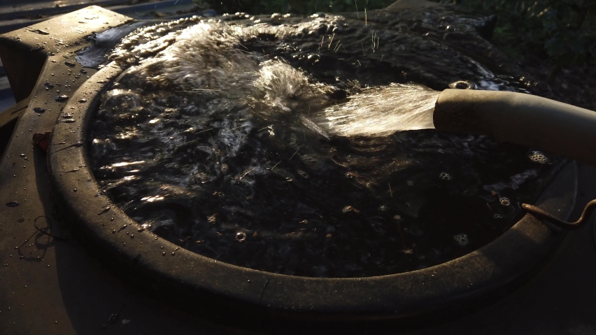 water tank overflowing pumping into stream Stock Footage Video (100% ...