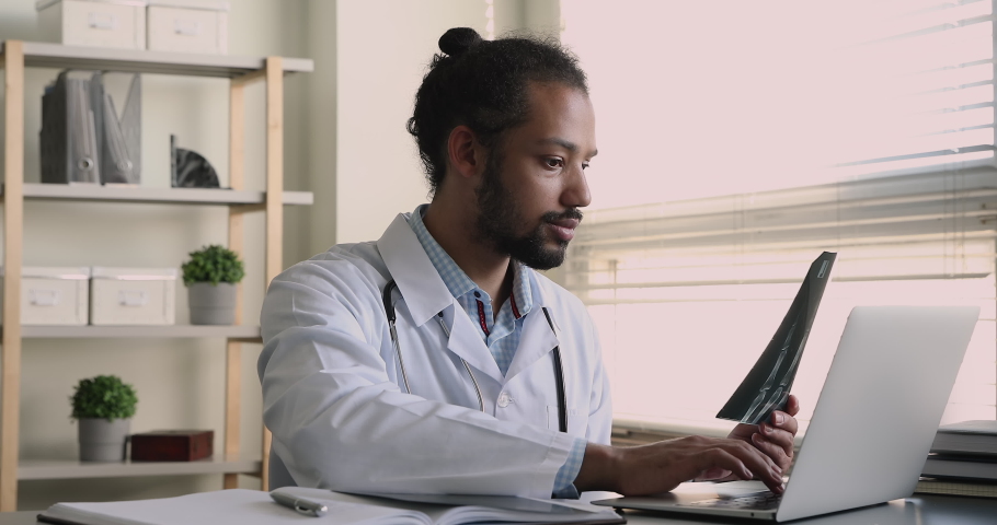 African American black man doctor is analyzing history disease of ...