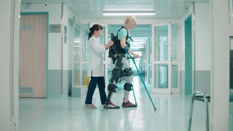 Doctor Helping Female Patient Walk Exosuit Stock Footage Video (100% ...