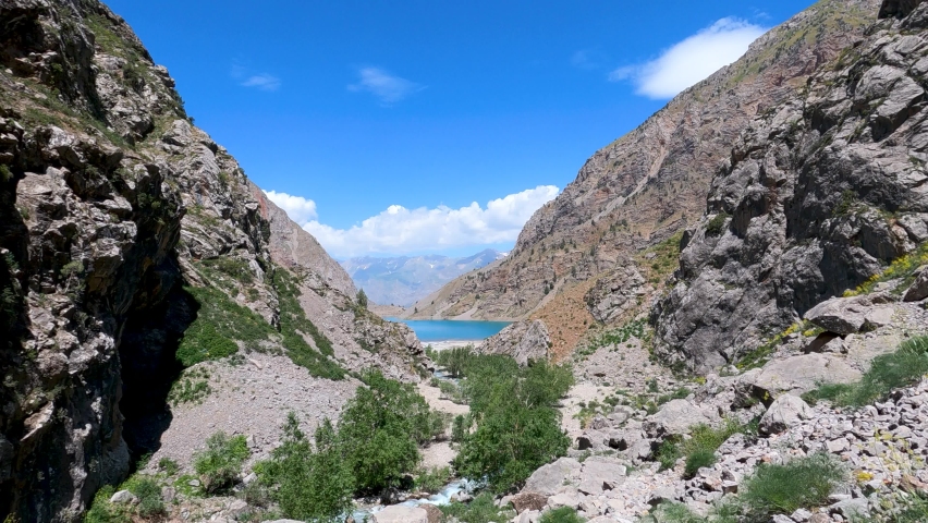 View Big Badak Lake Through Mountains Stock Footage Video (100% Royalty ...