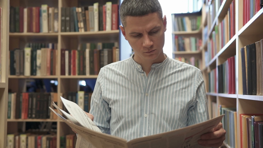 54 College student reading newspaper Stock Video Footage - 4K and HD ...