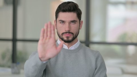 Portrait Young Man Showing Stop Sign Stock Footage Video (100% Royalty ...