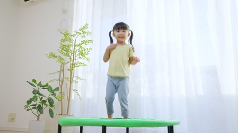 Asian Kid Jumping On Trampoline Stock Footage Video (100% Royalty-free ...