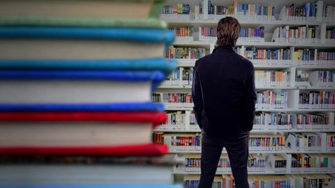 Man Bookstore Choosing Books Panning Through Stock Footage Video (100% ...