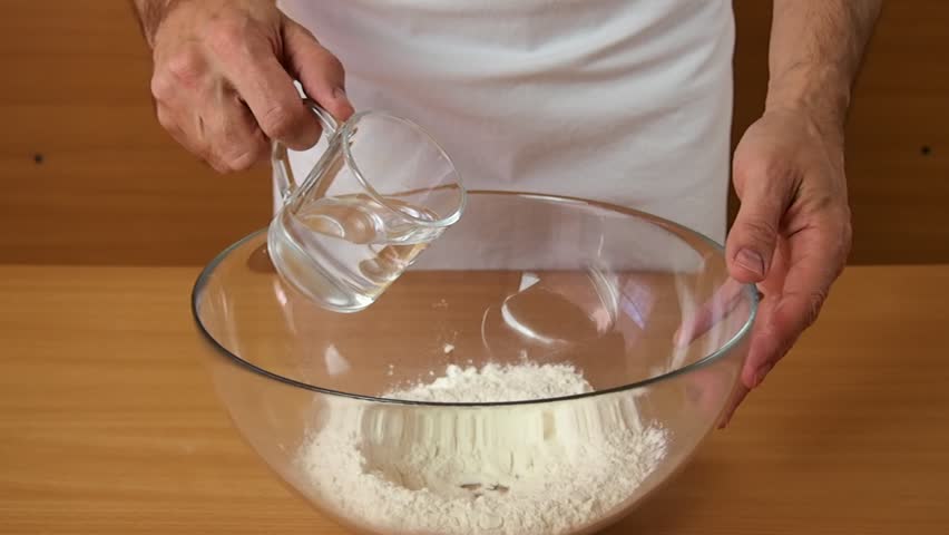 Add Water Into Flour. Making Stock Footage Video (100% Royalty-free ...