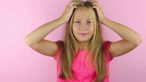 Girl Scratches Her Head On Colored Stock Footage Video (100% Royalty ...