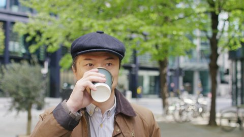 Young Asian Male Wearing Cap Walks Stock Footage Video (100% Royalty ...