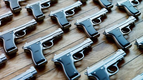 Seamless Looping Animation Pistols Shiny Guns Stock Footage Video (100% ...