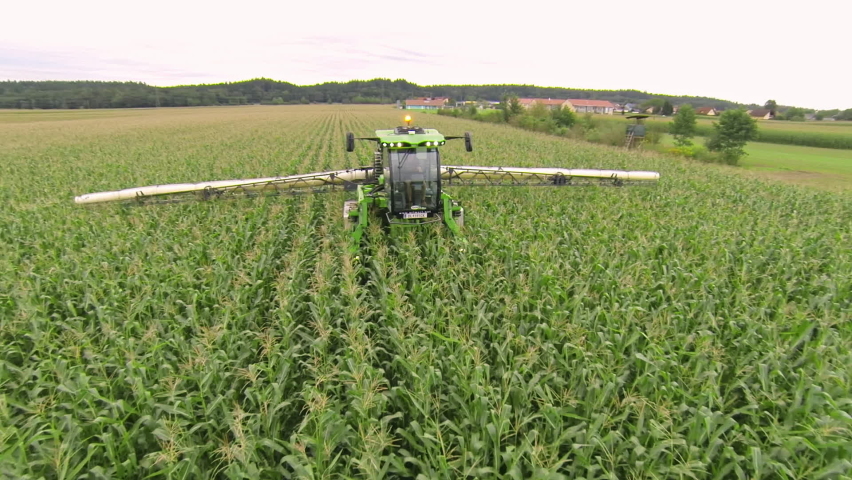 sprayering through corn field applying crop Stock Footage Video (100% ...