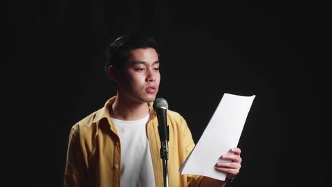 Asian Man Singer Holding White Paper Stock Footage Video (100% Royalty ...