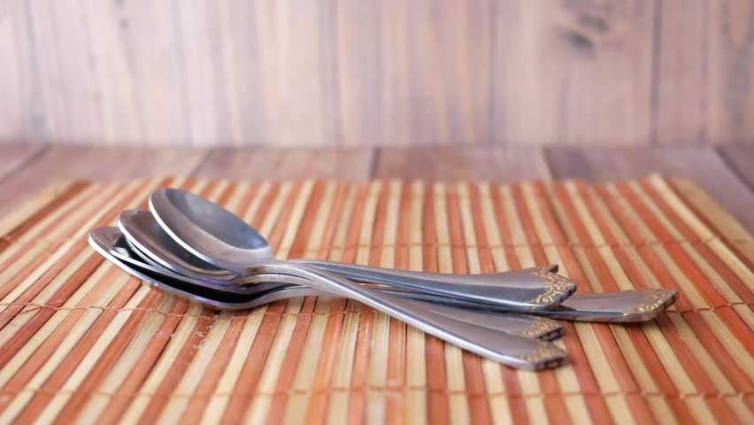putting sliver spoon table side view Stock Footage Video (100% Royalty ...
