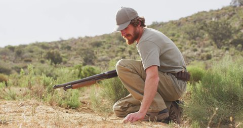 Kneeling Caucasian Male Survivalist Holding Hunting Stock Footage Video ...