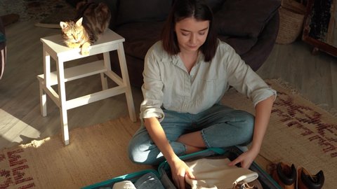 Young Travel Woman Cute Cat Packing Stock Footage Video (100% Royalty ...