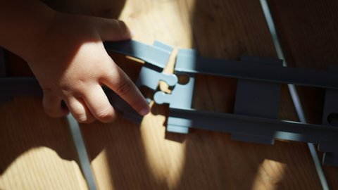 Child Hand Inserting Railroad Track Piece Stock Footage Video (100% ...