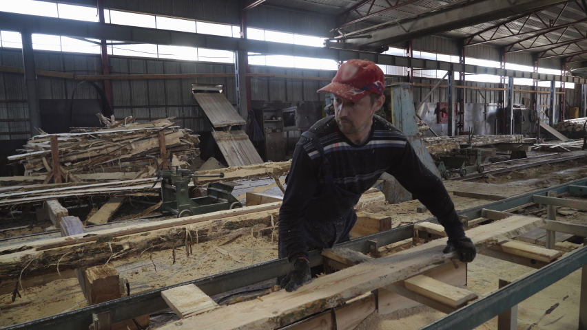 carpenter placing timber boards on production Stock Footage Video (100% ...