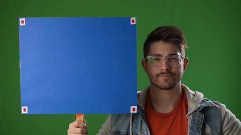 Smiling Man Holds Green Screen Chroma Stock Footage Video (100% Royalty ...