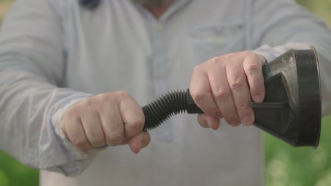 Man Stretches Corrugated Hose Car Funnel Stock Footage Video (100% ...