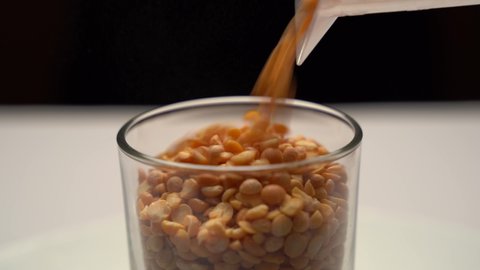 Process Pouring Yellow Peas Into Clear Stock Footage Video (100% ...