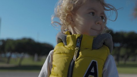 Cute Child Looking Around Park Yellow Stock Footage Video (100% Royalty ...