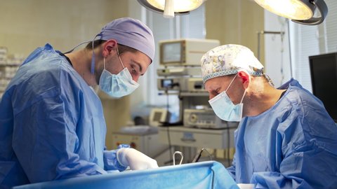 Men Surgeons Concentrated On Their Work Stock Footage Video (100% ...