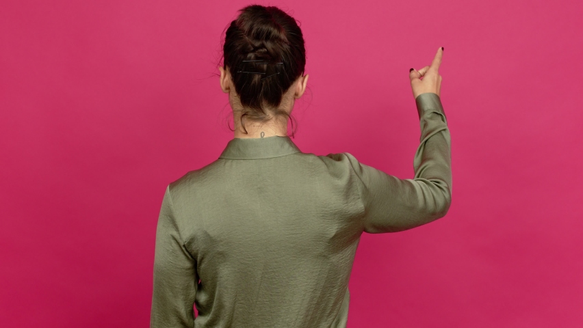 Pretty Woman Pointing Back Index Finger Stock Footage Video (100% ...